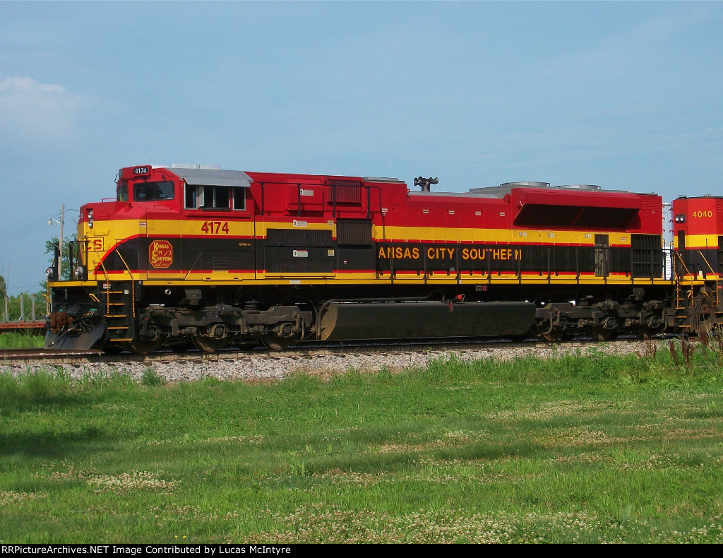 KCS 4174 tied down westbound KCS empty grain train
